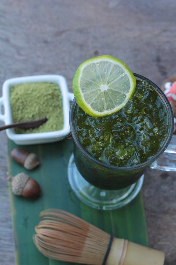 Iced Green Tea with Lemon and Matcha Tea Powder. Stock Image - Image of ...