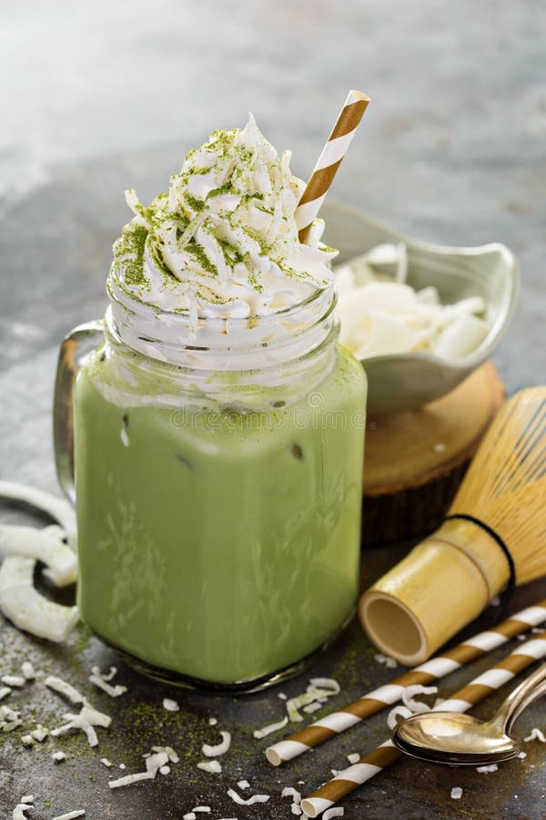Iced Matcha Drink Topped with Whipped Cream Served in a Clear Plastic ...