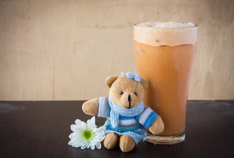 Iced Milk Tea with Tapioca Pearls, Milk Splashes, and Pearls Frozen in ...