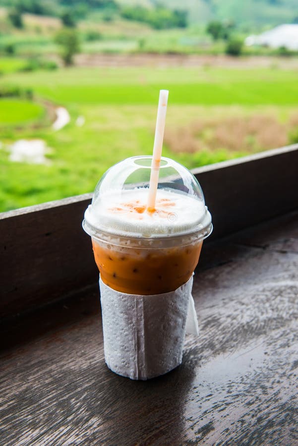 Iced Milk Tea in Plastic Glass with Natural View Stock Image - Image of ...