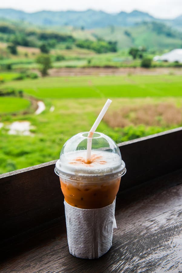 Iced Milk Tea in Plastic Glass with Natural View Stock Image - Image of ...