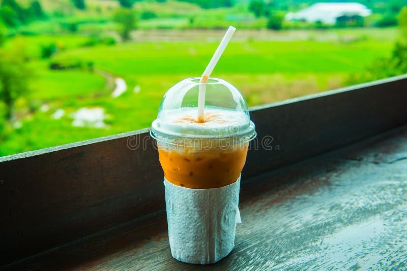 Iced Milk Tea in Plastic Glass with Natural View Stock Photo - Image of ...