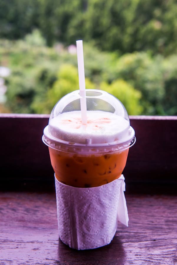 Iced Milk Tea in Plastic Glass with Natural View Stock Photo - Image of ...