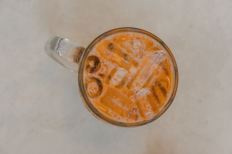 Iced Milk Tea or Thai Milk Tea with Ice in Glass Stock Photo - Image of ...