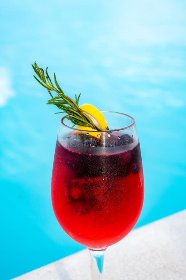 Iced Mixed Berry Cocktail Against Pool Side Stock Photo - Image of ...