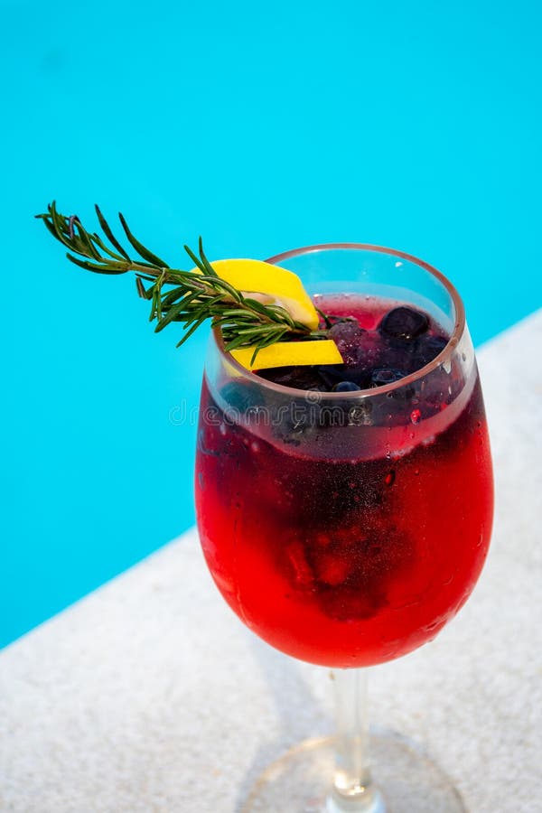 Iced Mixed Berry Cocktail Against Pool Side Stock Photo - Image of ...