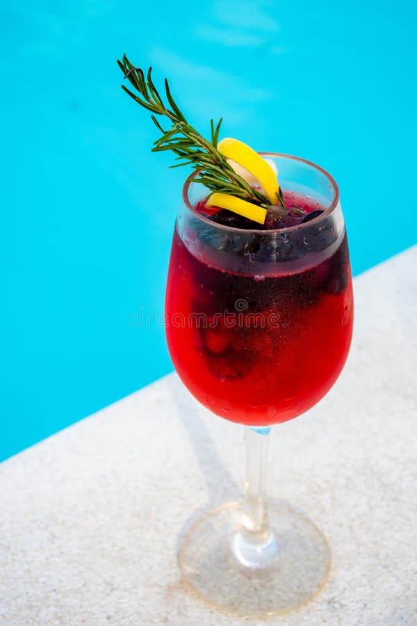 Iced Mixed Berry Cocktail Against Pool Side Stock Image - Image of ...
