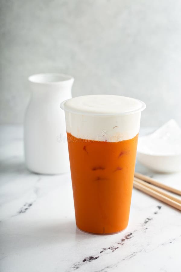 Iced Orange Mango Tea with Cold Foam in Tall Glass Stock Image - Image ...
