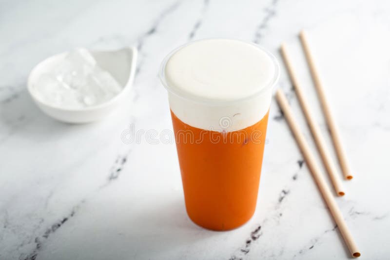 Iced Orange Mango Tea with Cold Foam in Tall Glass Stock Photo - Image ...