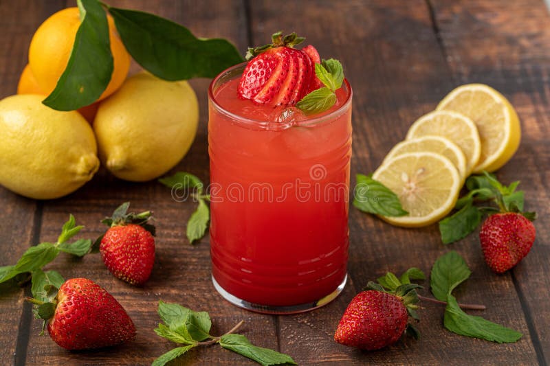 Iced Strawberry Lemonade in Glass Glass on Wooden Table Stock Image ...