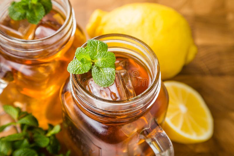 Iced tea in glass jars stock photo. Image of lemon, island - 85080334