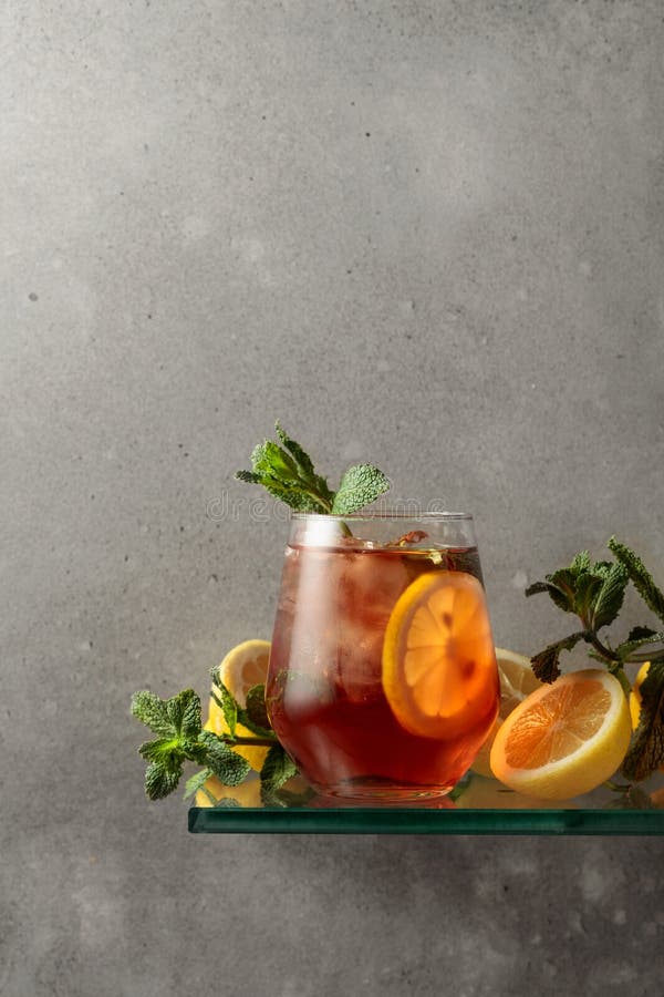 Iced Tea with Lemon and Mint on the Background of the Grey Concrete ...