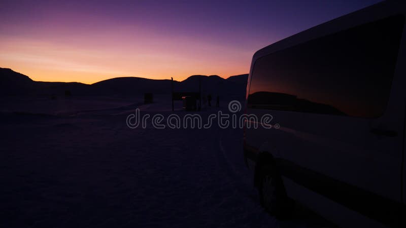 Icelandic Sunset Reflected on Minibus Window with Snowy Plain and ...