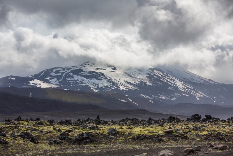 Icelandic Volcano with Snow and Cloudy Sky Stock Photo - Image of snow ...