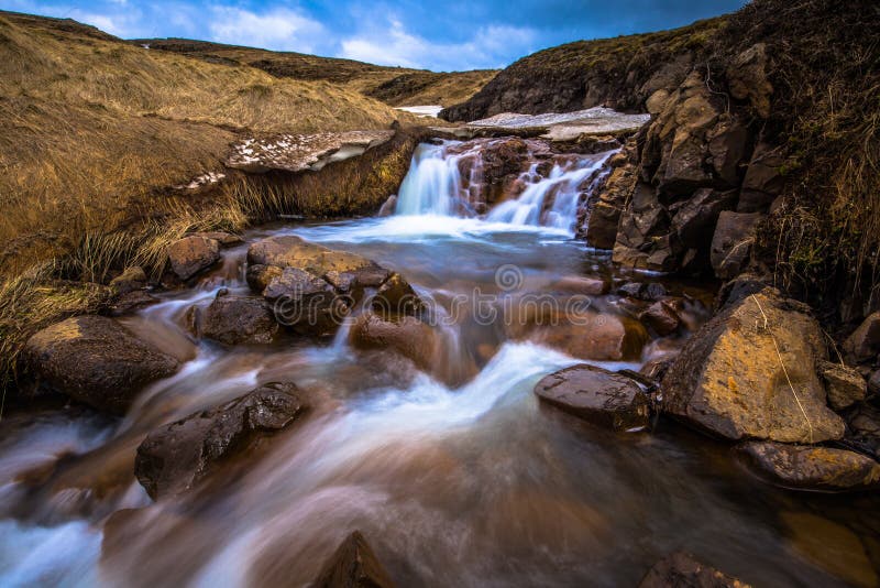 Icelandic Wilderness - May 08, 2018: Small Waterfall in the Icy ...