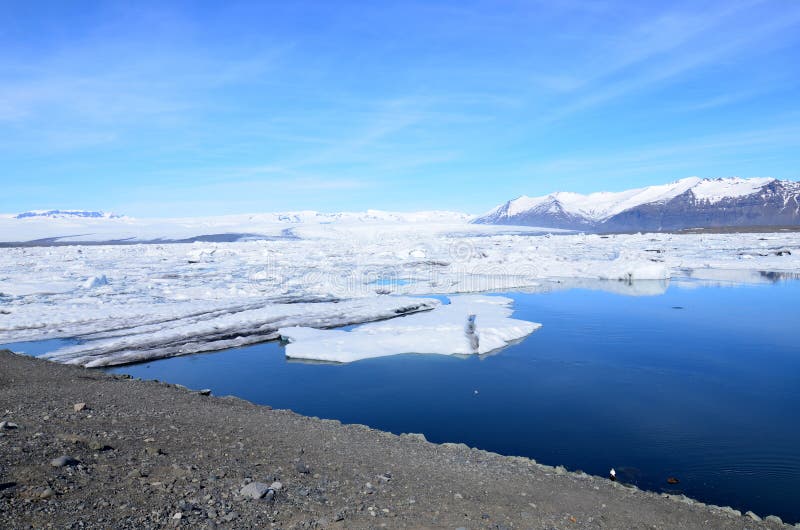 Icey Mountains Surrounding the Ice Melt in a Lagoon Stock Photo - Image ...