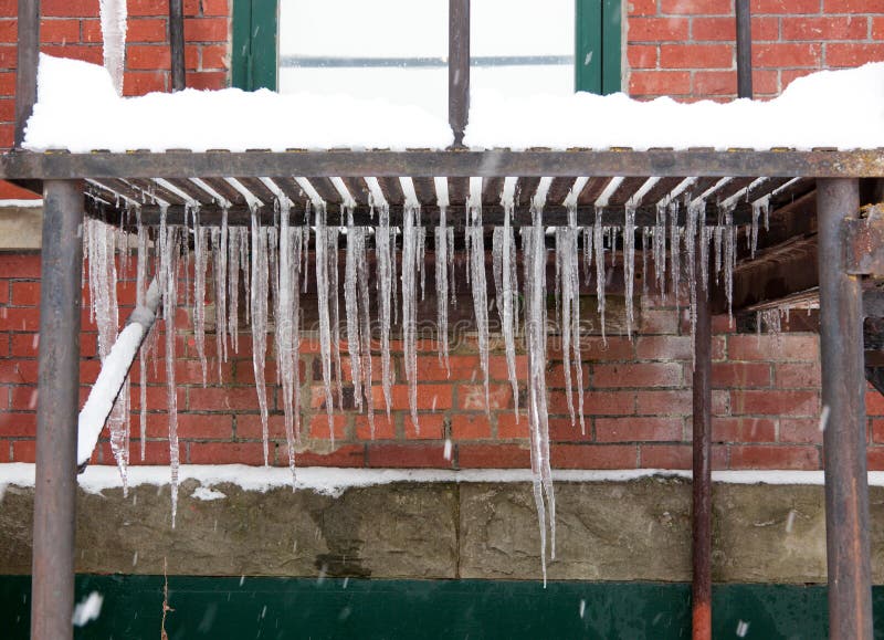 Icicle on Metal Grate stock image. Image of grate, brick - 26903281