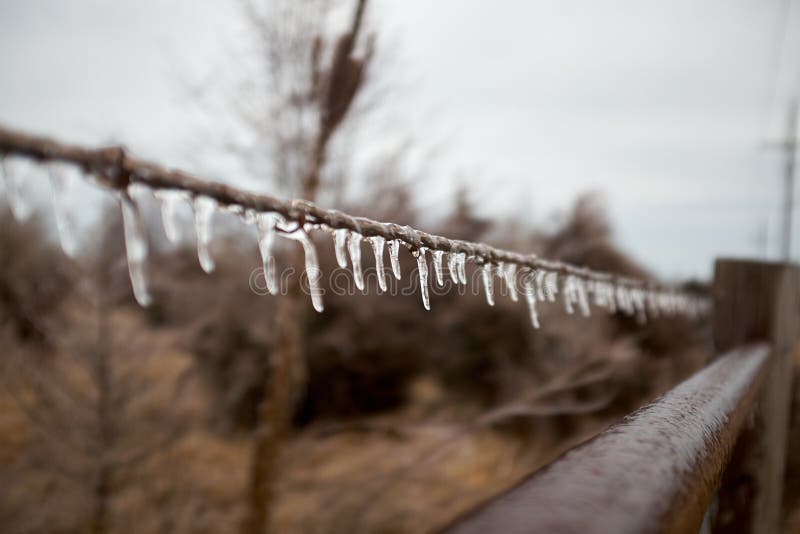 Icicles Dangling from a Strand of Wire or Rope Stock Image - Image of ...