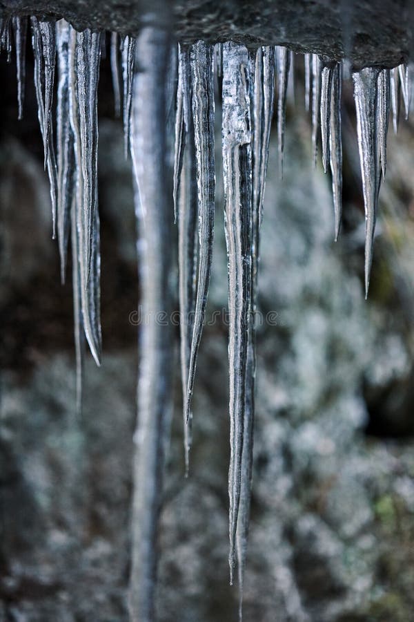 Icicles Hanging on Mountain Rock Stock Image - Image of frost, bright ...