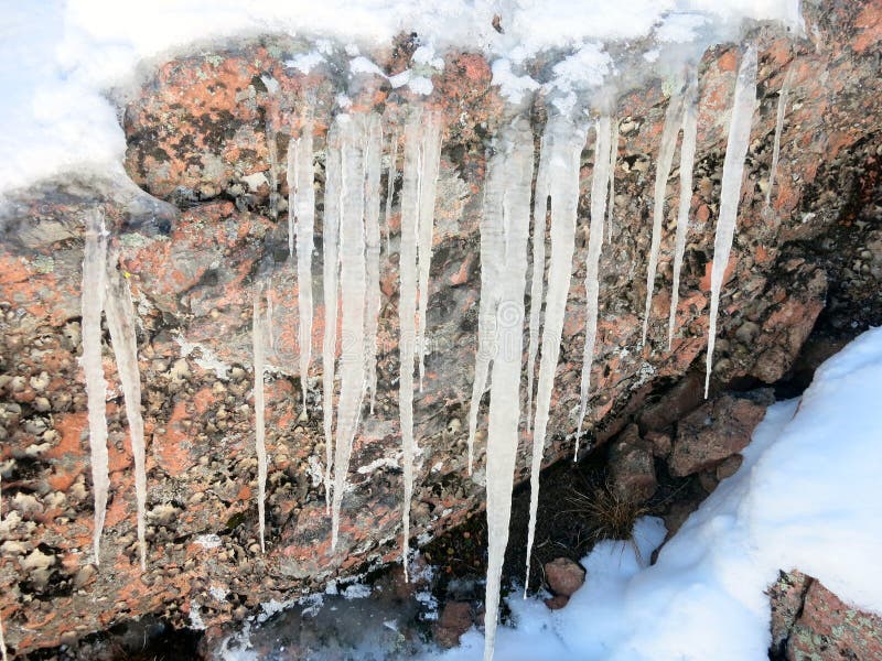 Icicles Hanging from a Rock Stock Photo - Image of freezing, winter ...