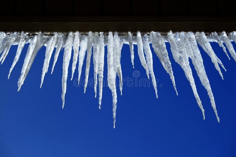 Icicles Hanging from Rooftop of Home Melted Ice Dripping Stock Photo ...