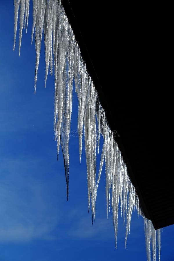 Icicles Hanging from Rooftop of Home Melted Ice Dripping Stock Image ...