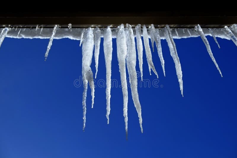 Icicles Hanging from Rooftop of Home Melted Ice Dripping Stock Image ...