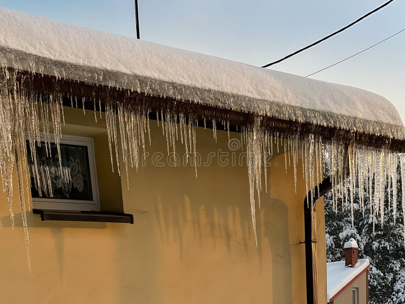 Icicles Hanging from Thatched Roofs Stock Photo - Image of frost ...