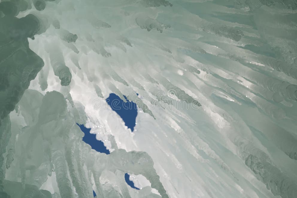 Icicles on Ice Cave Ceiling with Blue Sky Poking through Stock Photo ...