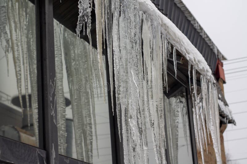 Icicles of Ice Hang from the Roof Stock Image - Image of city, cornice ...