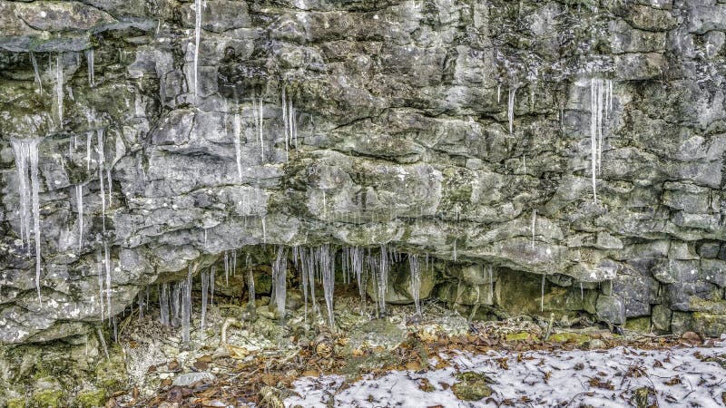 Icicles on a Rock Cliff Face in Late Fall Stock Image - Image of ...
