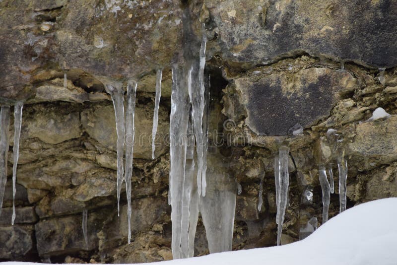 Icicles meet Snow stock photo. Image of cold, winter - 210142188
