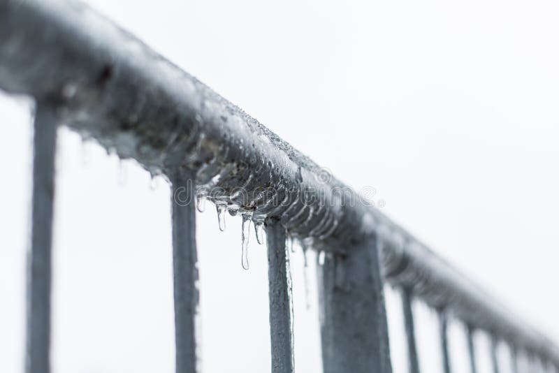 Icicles melting on a fence stock image. Image of frost - 37431445