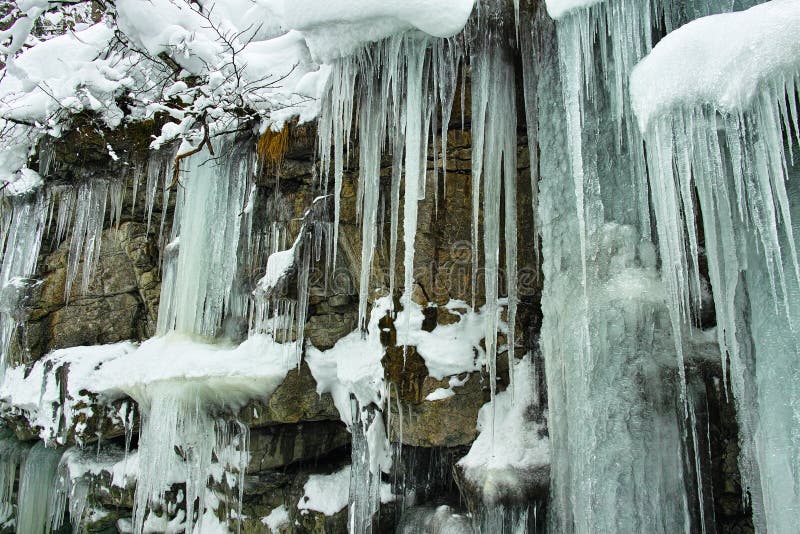 Icicles on rock face stock image. Image of long, deepfreezed - 57698965