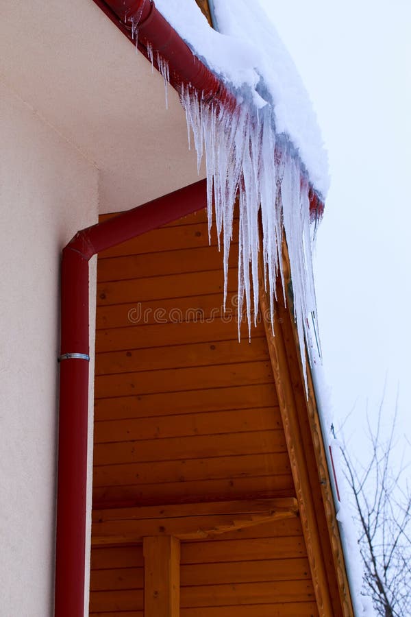 Icicles on the roof stock image. Image of hanging, melted - 140826905