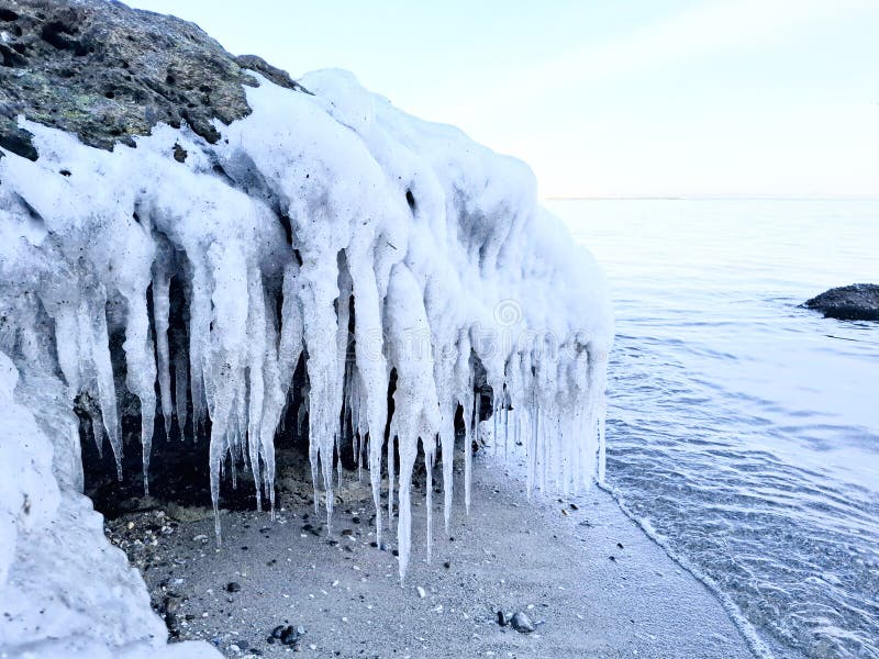 Icicles on the seashore stock image. Image of formation - 364671939