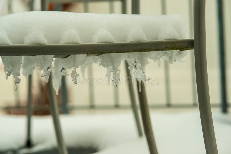 Icicles and Snow on a Chair on a Balcony Stock Photo - Image of frozen ...