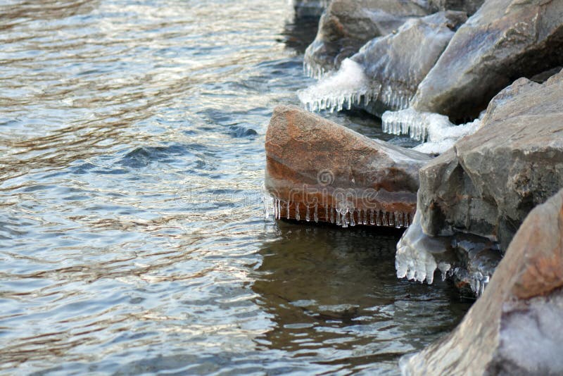Icicles on Stone on the Beach in Sunny Winter Day Stock Image - Image ...