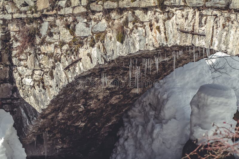 Icicles Under the Arch of the Bridge Stock Photo - Image of bridge ...