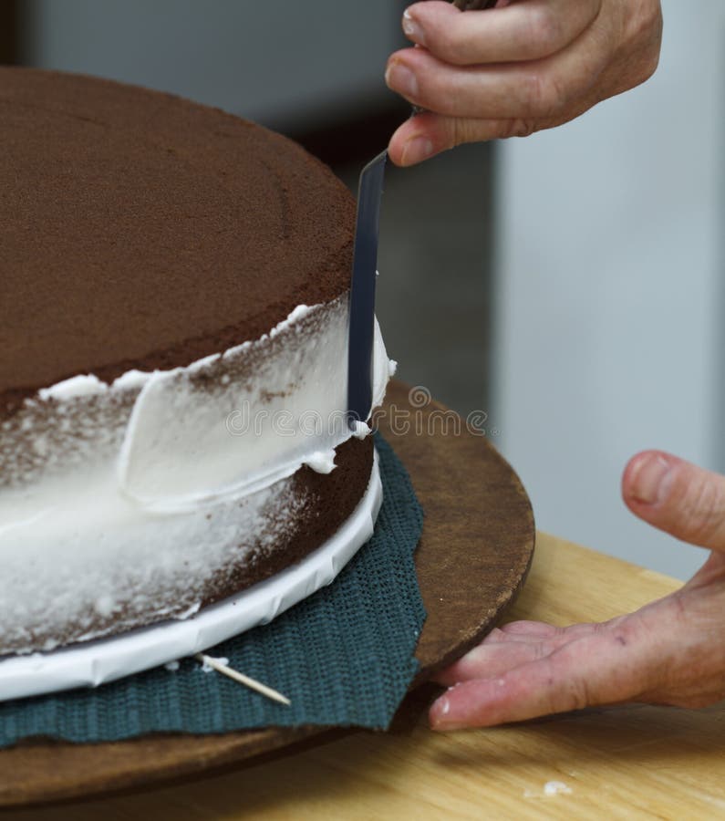 Icing the Cake stock image. Image of dessert, decorator - 14423941