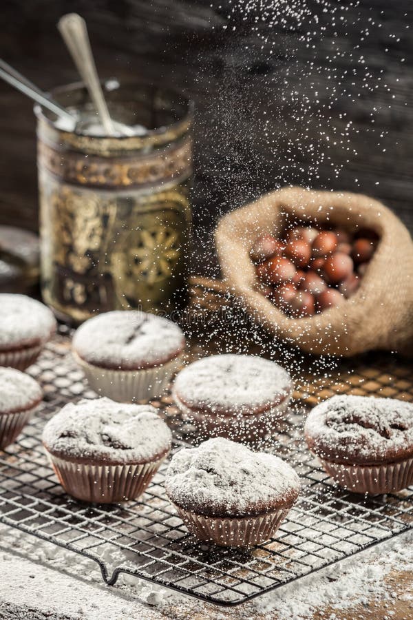 Icing Sugar Falling on Fresh Chocolate Muffins Stock Image - Image of ...