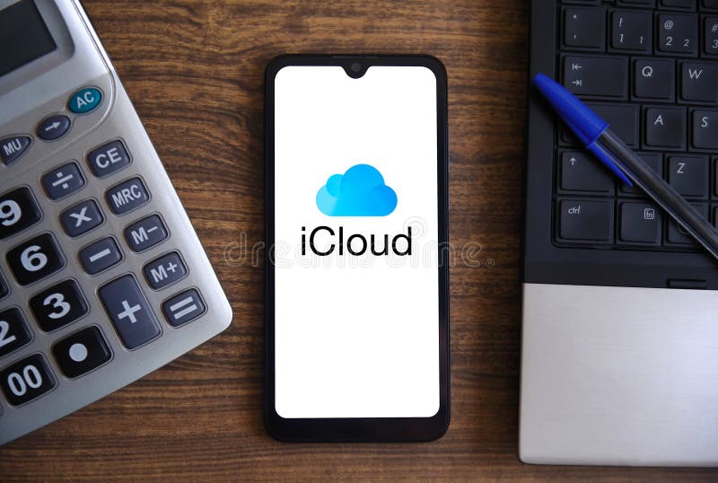 The ICloud Logo, Apple S Cloud Service, is Displayed on a Smartphone Screen on a Table with ...