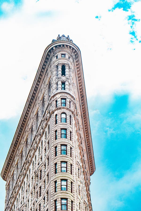 Iconic Architecture of Triangular Skyscraper Against Blue Sky ...