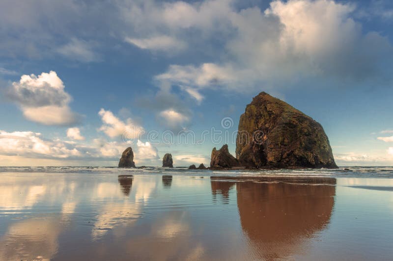 Haystack at Cannon Beach stock photo. Image of evening - 354856394