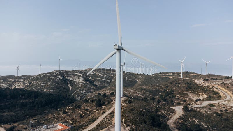 Iconic Windmill Sitting Atop a Grass-covered Hillside in a Rural ...