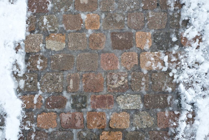 Icy cobblestone pavement stock image. Image of service - 81052071