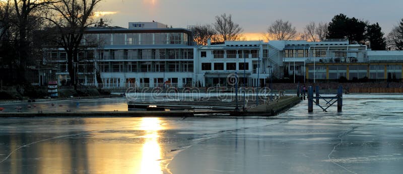 Icy harbor stock photo. Image of siofok, lake, snow, sunset - 65561454