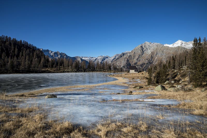 Icy lake stock photo. Image of mountains, cracks, mountain - 64687362