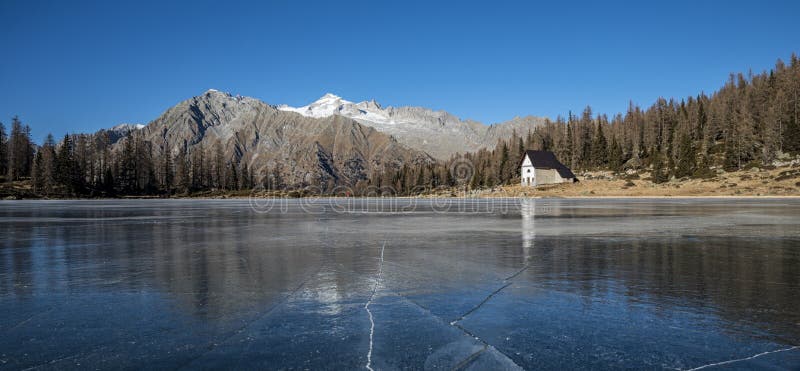 Icy lake stock photo. Image of alpine, chalet, scenery - 64688114