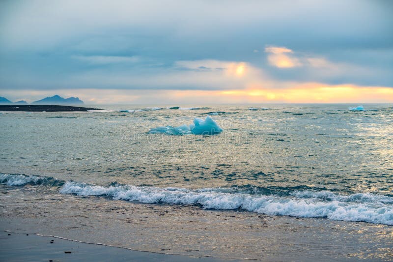 Icy Ocean Waves at Sunset stock image. Image of cold - 358585243